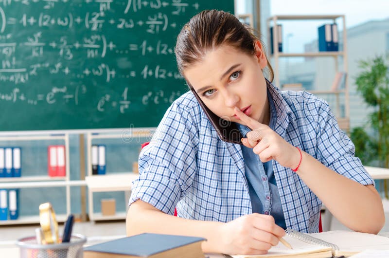 The Young Female Student Taking the Exam in Classroom Stock Photo ...