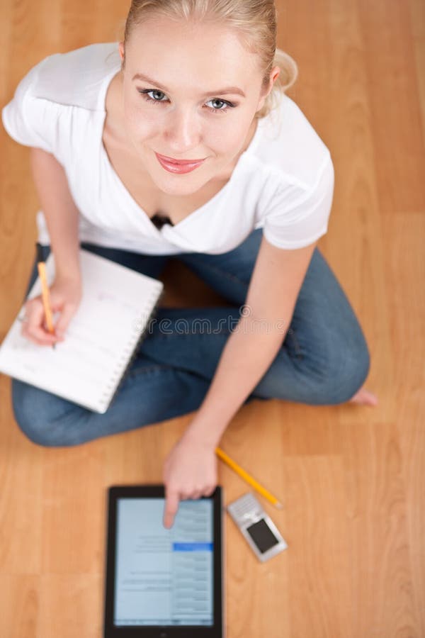 Young Female Student Taking Notes while Studying Stock Photo - Image of ...