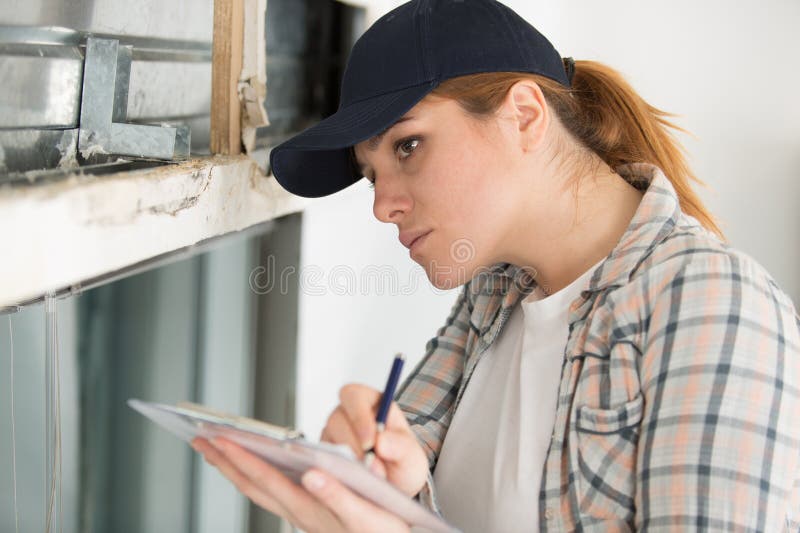 Young Female Supervisor Taking Notes Stock Photo - Image of site ...
