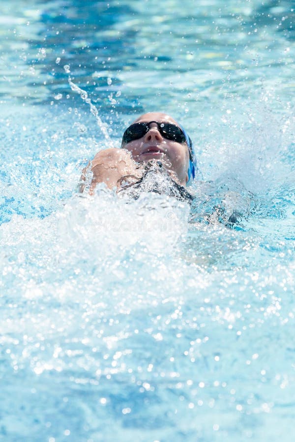 Woman Swimming the BAckstroke Stock Photo - Image of pools, swimmers ...