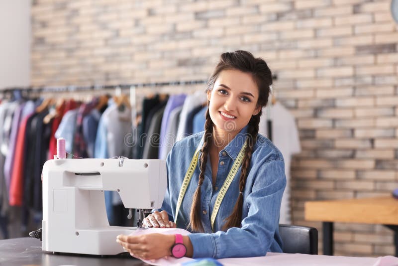 Young Female Tailor Using Sewing Machine in Atelier Stock Image - Image ...