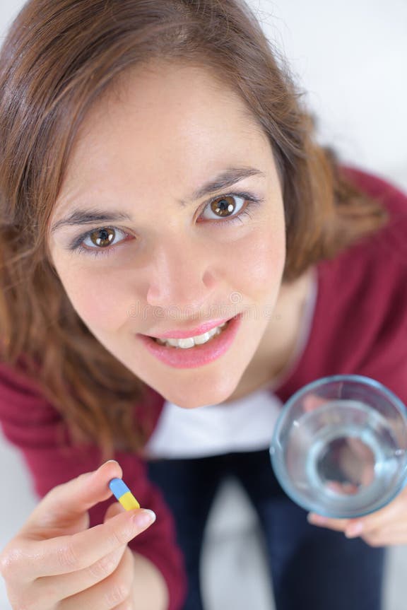 Young female talking pill stock image. Image of face - 101671645