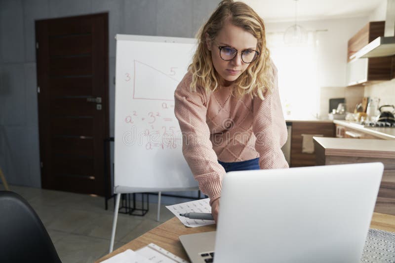 Female Teacher Conducts Online Lessons and Shows Documents Stock Photo ...