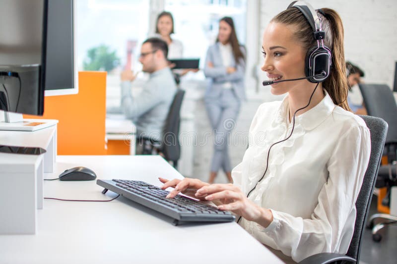 Young Female Technical Support Dispatcher Working in Office. Stock ...