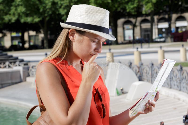 Young Female Tourist Reading Printed Map Stock Image - Image of ...