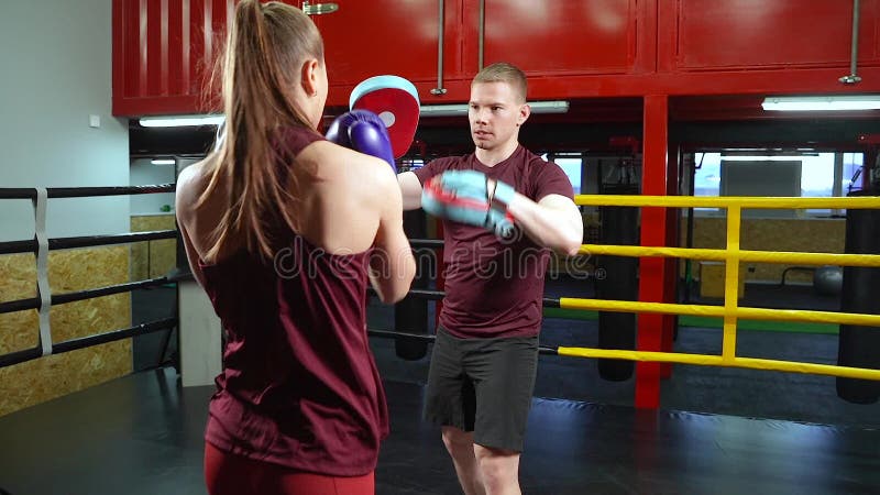 Young Female Training in the Boxing Ring with Pad Work Stock Video ...