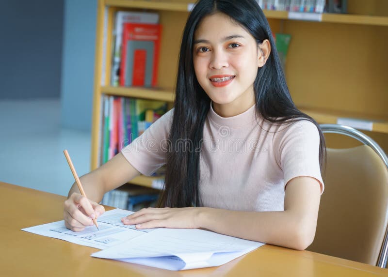 Young Female University Student Concentrate Doing Language Practice ...