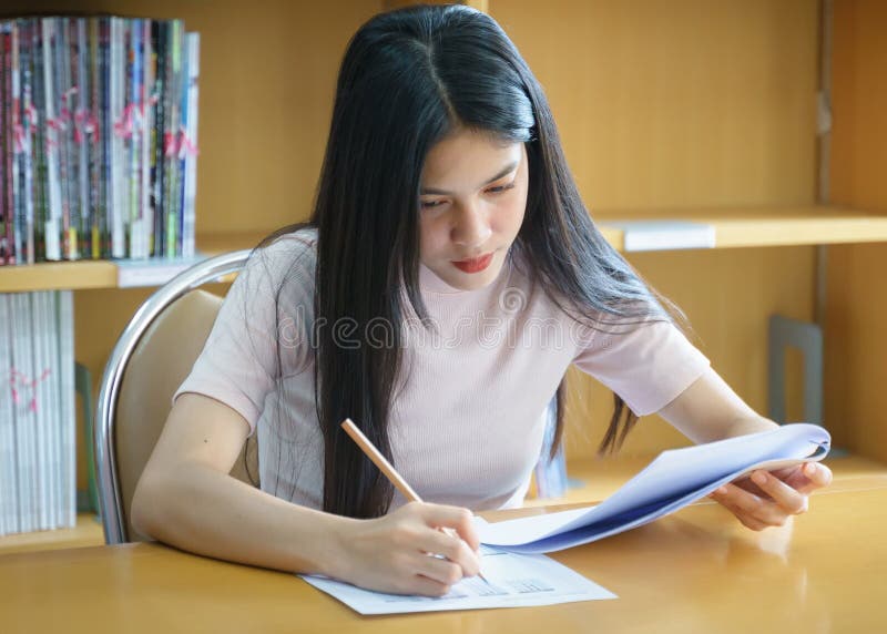 Young Female University Student Concentrate Doing Language Practice ...