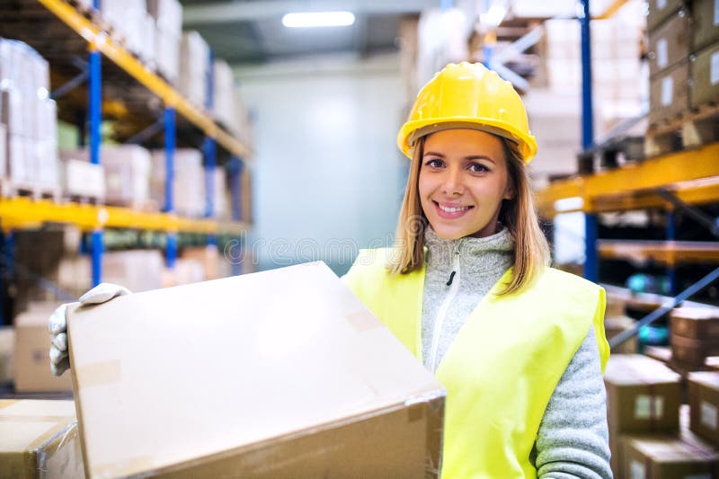 Female Warehouse Worker Loading Boxes. Stock Photo - Image of plastic ...