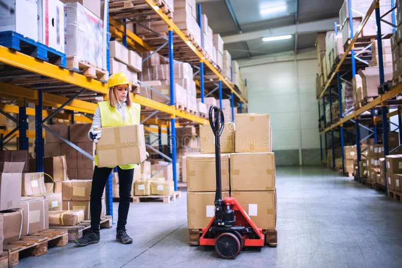 Female Warehouse Worker Loading Boxes. Stock Image - Image of ...