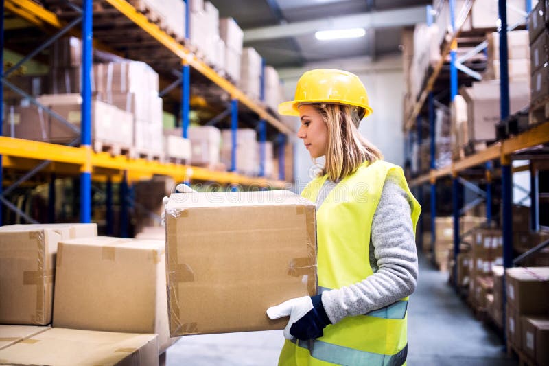 Female Warehouse Worker Loading Boxes. Stock Photo - Image of goods ...
