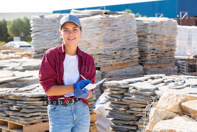 Young Female Worker Checking Quantity of Natural Stone Tiles Stock ...