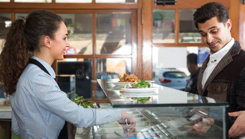 Young Female Worker Serving Customer with Smile Stock Image - Image of ...