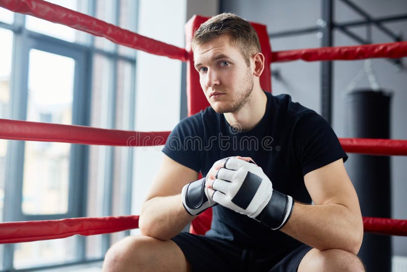 Young Fighter Sitting in Boxing Ring Stock Photo - Image of active ...