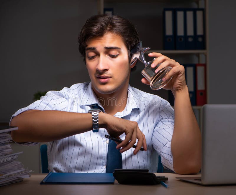 Young Financial Manager Working Late at Night in Office Stock Photo ...