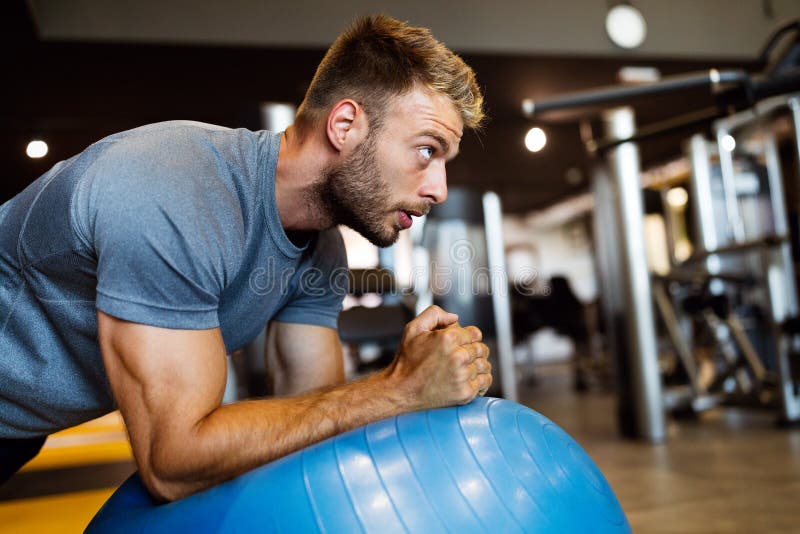 Young Handsome Man Doing Exercises in Gym Stock Image - Image of biceps ...