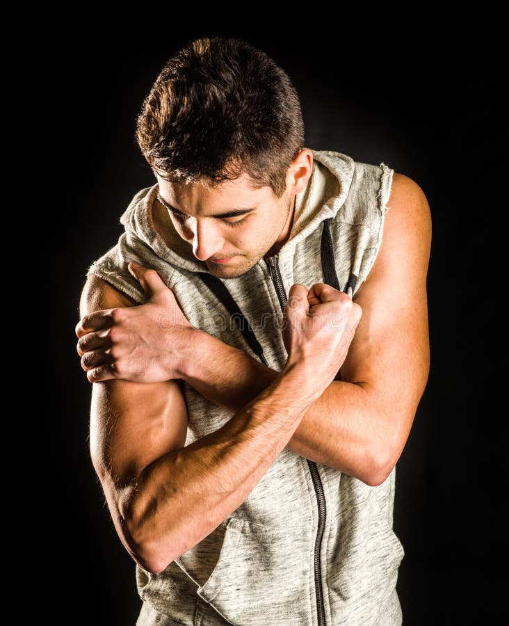Man Stretching Arms Outward Doing a Standing Dumbbell Chest Fly. Studio ...