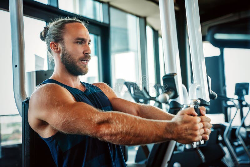 Young Muscular Man during Workout in the Gym Stock Photo - Image of ...
