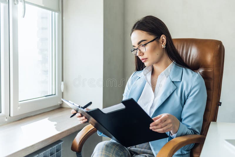 Young Focused Woman Working with Chart Stock Photo - Image of ...