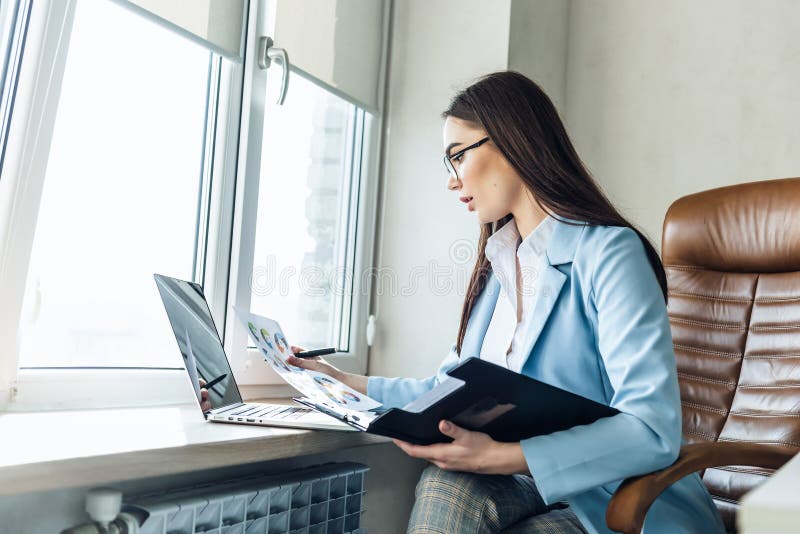 Young Focused Woman Working with Chart Stock Photo - Image of adult ...