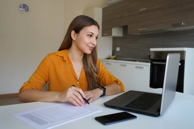 Young Focused Woman Working Filling Out Documents from Home Stock Image ...