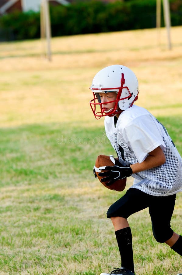 Young Football Player Catching Ball. Stock Image - Image of athlete ...