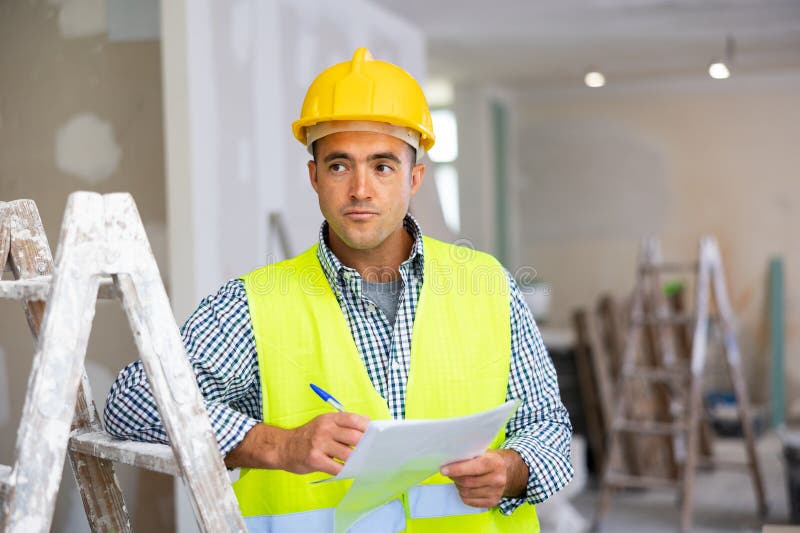Young Foreman Checks the Completed Construction Work and Signs the ...