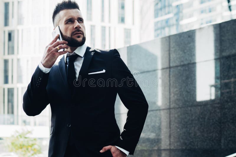 Young Formal Male Speaking on Phone Standing on Street Stock Photo ...
