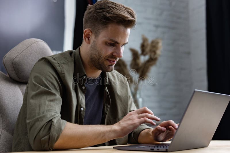 Young Freelancer Working in Home with Laptop. Texting Messages ...
