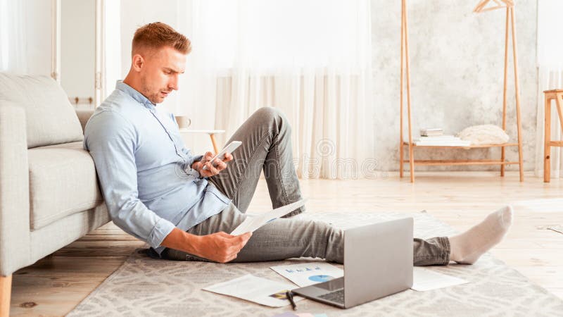 Portrait of Man Sitting on Floor Using Phone and Pc Stock Image - Image ...