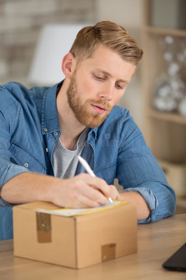 Young Freight Manager Checking Invoice with Cardboard Box Parcel Stock Image - Image of form ...