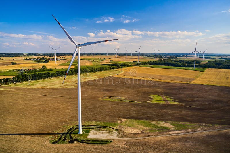 Young Fresh Fields with Windmills during the Sowing Campaign. an ...