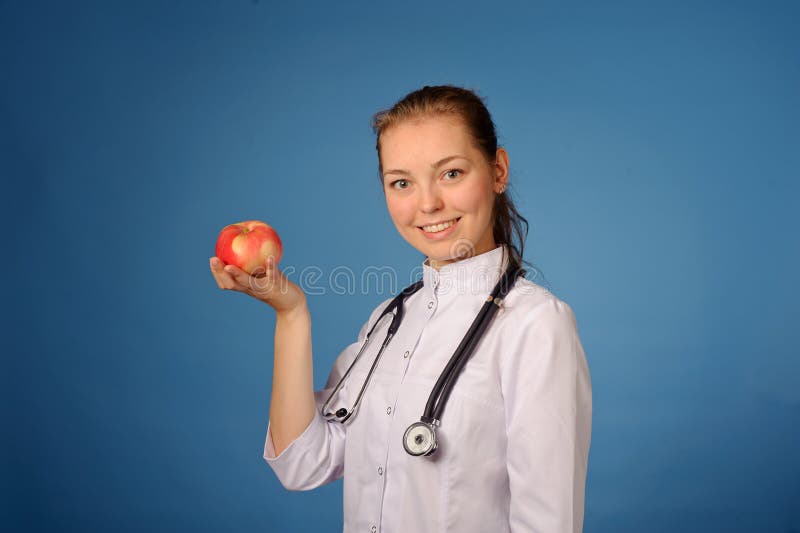 Young Friendly Female Doctor with Apple Stock Image - Image of girl ...