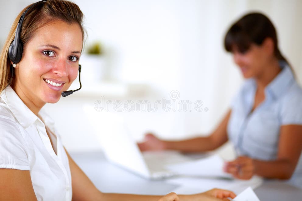 Young Friendly Receptionist Wearing Headphone Stock Image - Image of ...