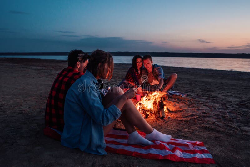 Young Friends Have Picnic with Bonfire on the Beach Stock Image - Image ...