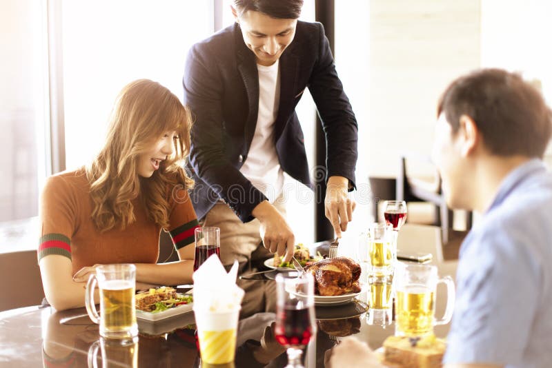 Young Friends Having Dinner Together Stock Photo - Image of friendship ...