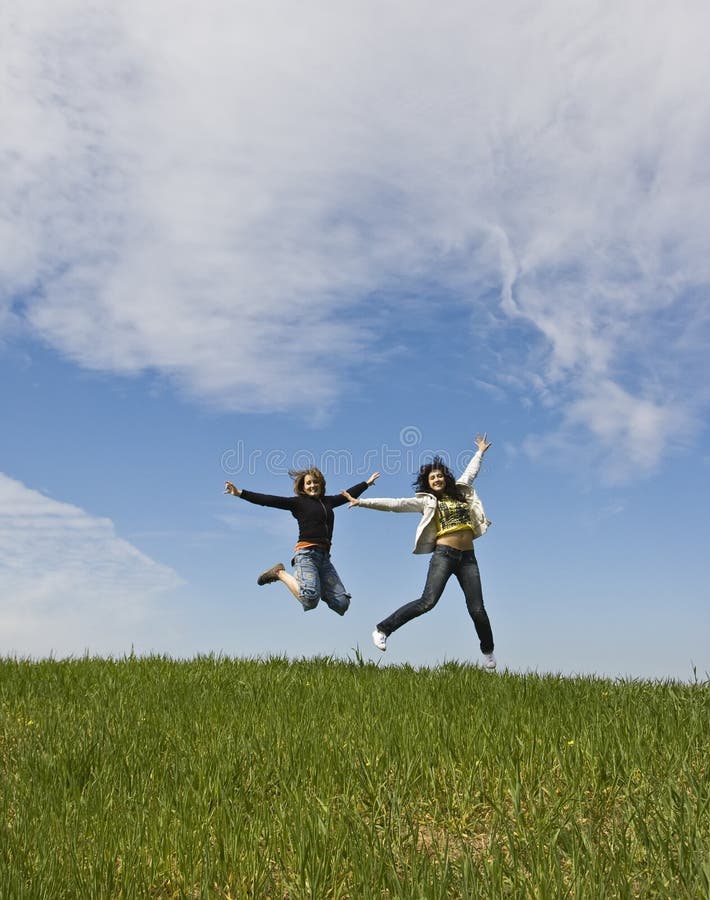 Young friends jumping stock photo. Image of grass, clear - 5372088