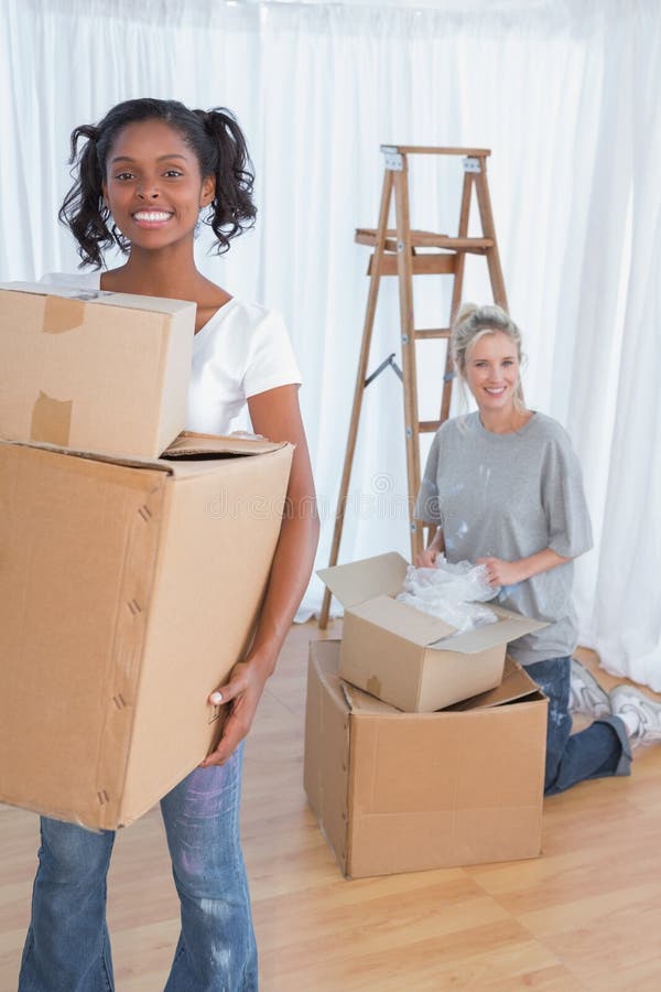Young Friends Moving into New Home Stock Image - Image of friend, home ...