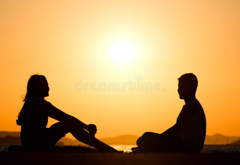 Couple walking in sunset stock photo. Image of walking - 1461080