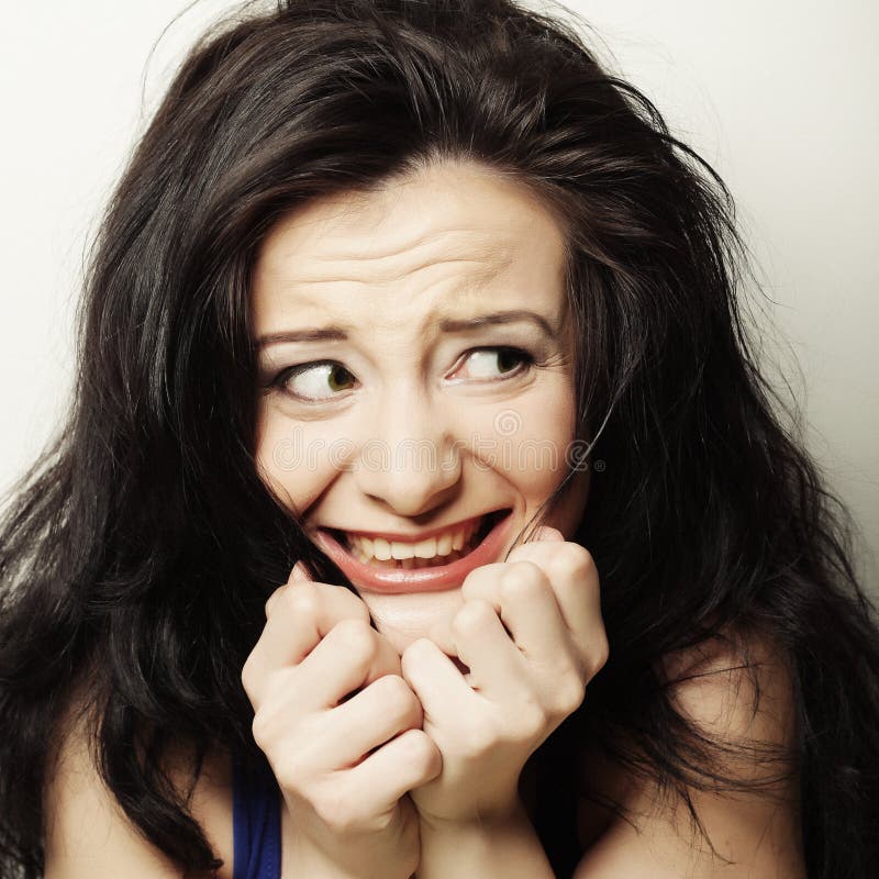 A young frightened woman stock image. Image of emotion - 63186651