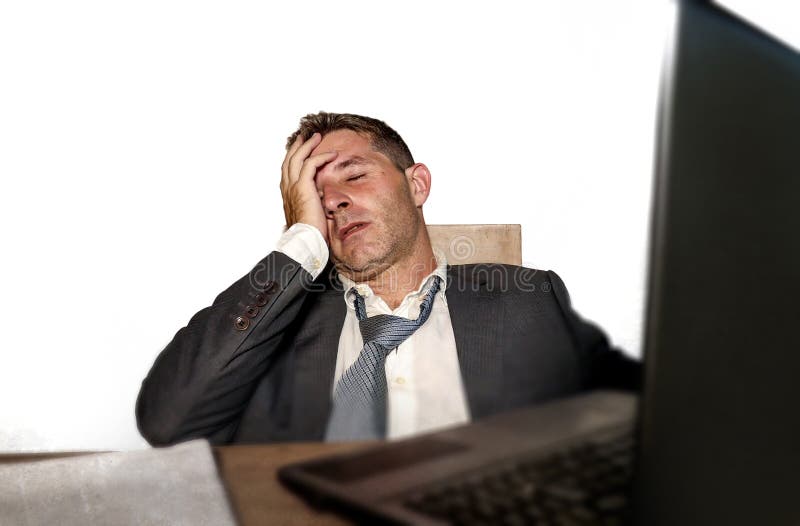 Young Frustrated And Stressed Businessman In Suit And Tie Working