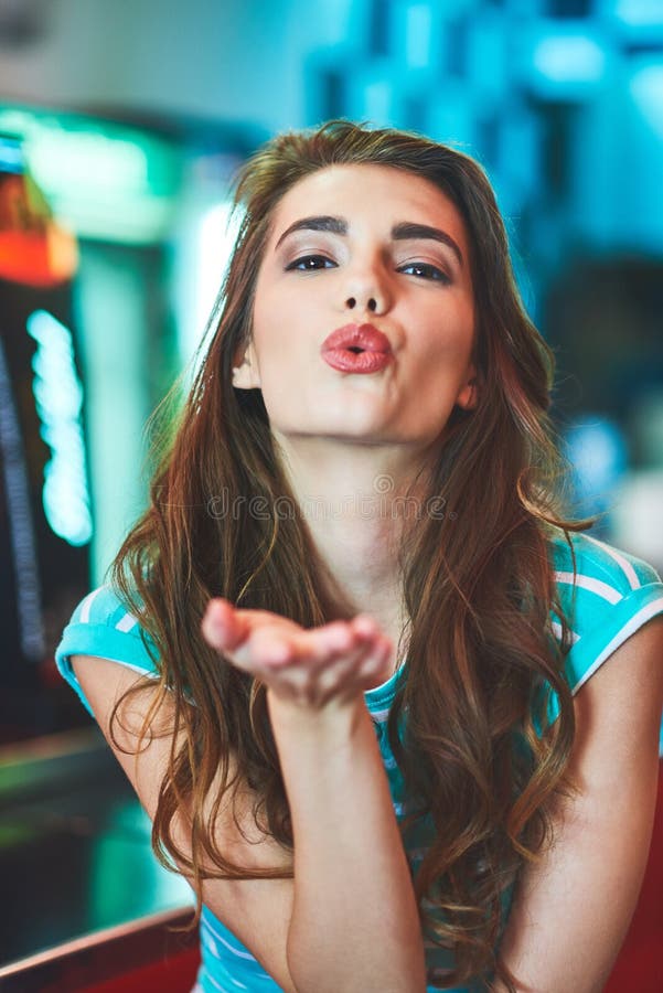 Young, Fun and Flirty. Shot of a Beautiful Young Woman in a Diner ...