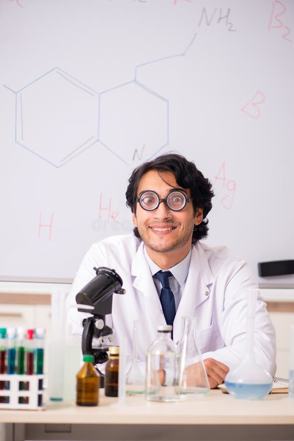 The Young Funny Chemist in Front of White Board Stock Photo - Image of ...
