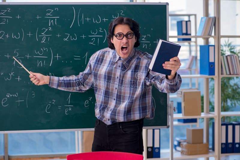 The Young Funny Math Teacher in Front of Chalkboard Stock Photo - Image ...