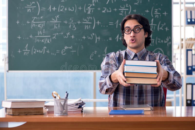 The Young Funny Math Teacher in Front of Chalkboard Stock Photo - Image ...