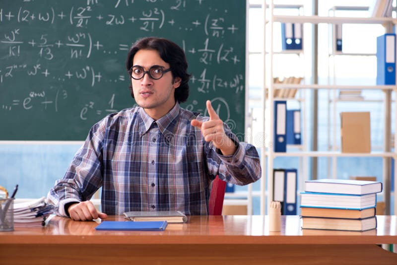 The Young Funny Math Teacher in Front of Chalkboard Stock Image - Image ...