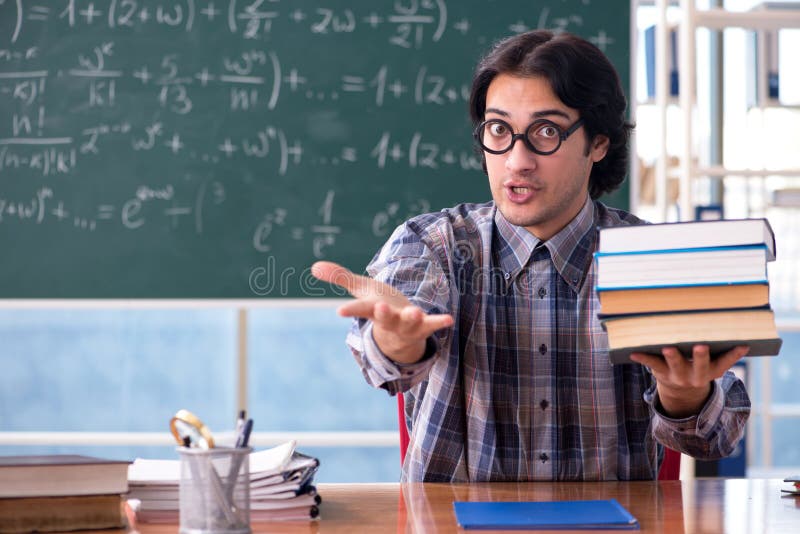The Young Funny Math Teacher in Front of Chalkboard Stock Image - Image ...