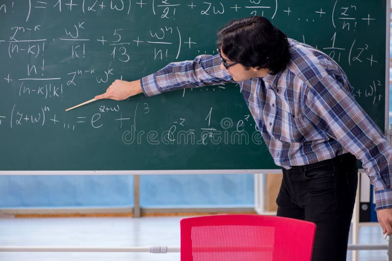 The Young Funny Math Teacher in Front of Chalkboard Stock Photo - Image ...