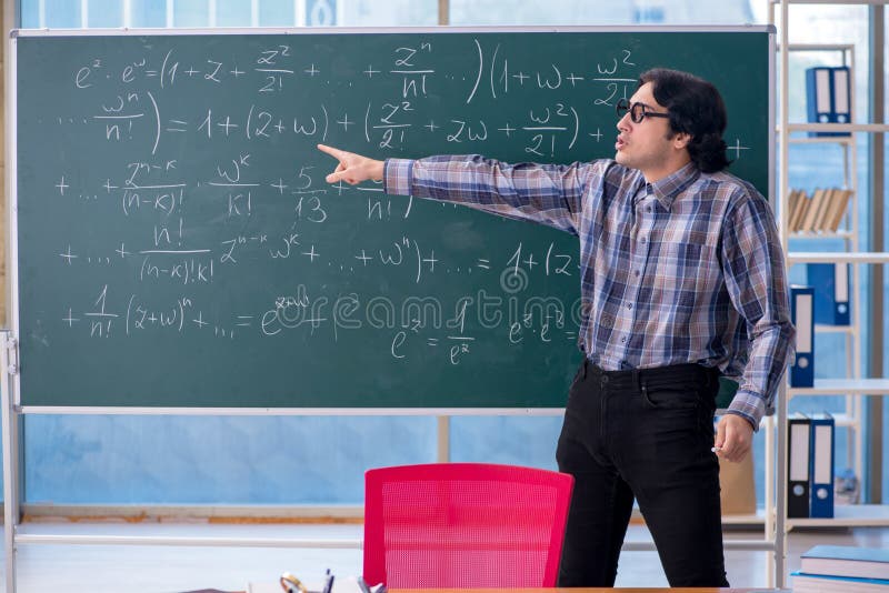 The Young Funny Math Teacher in Front of Chalkboard Stock Image - Image ...