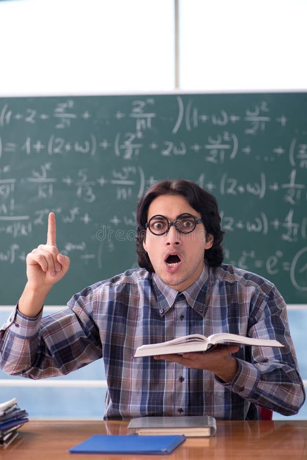 The Young Funny Math Teacher in Front of Chalkboard Stock Photo - Image ...